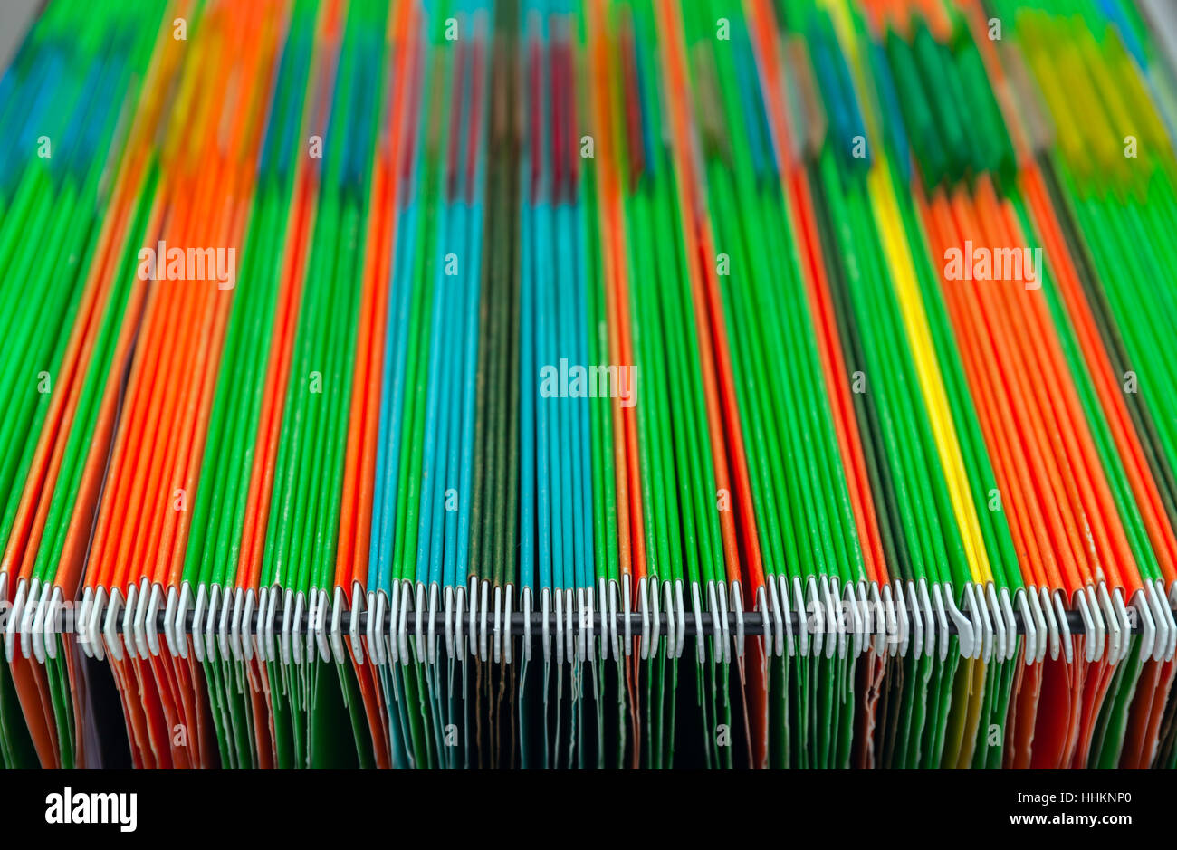 Filing cabinets filled with files of several colors. Abstract ...