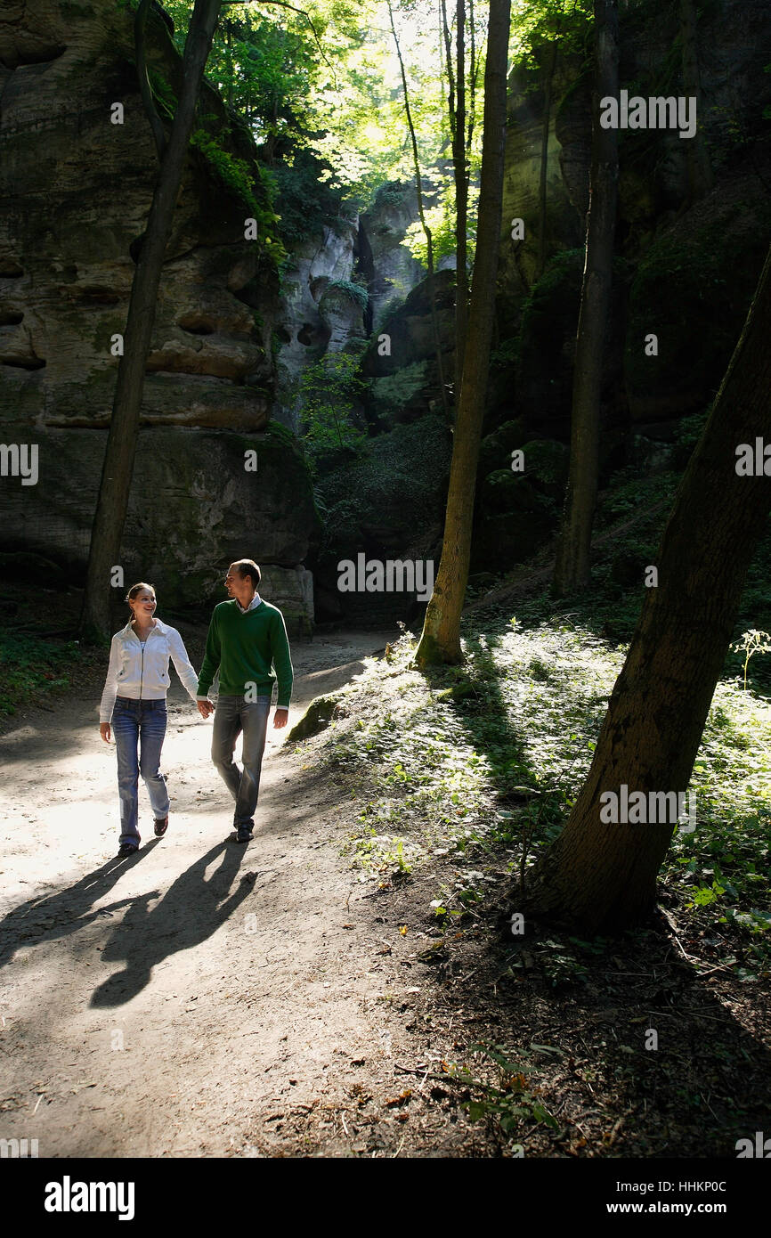 young couple walking through forest Stock Photo - Alamy