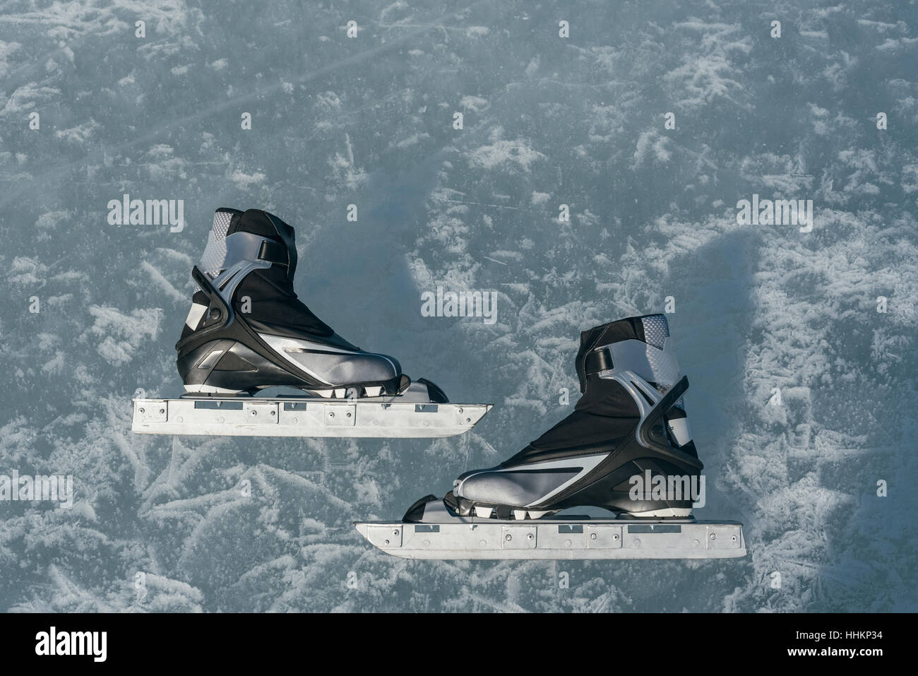 Tourists travel to Norway hiking ice skating on the frozen lake ...