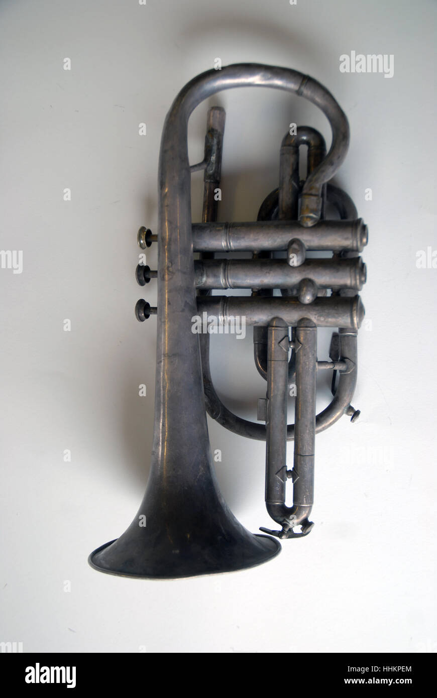 A vintage brass trumpet on a white table top, Portsmouth, Hampshire, UK ...