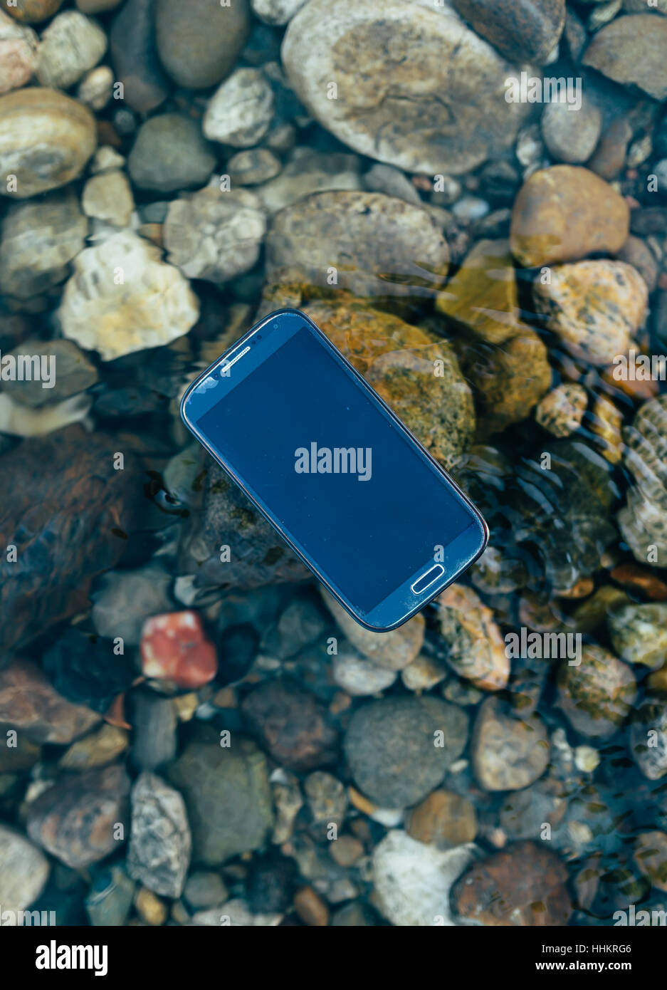 Lost man modern smartphone supported floating on the water Stock Photo ...