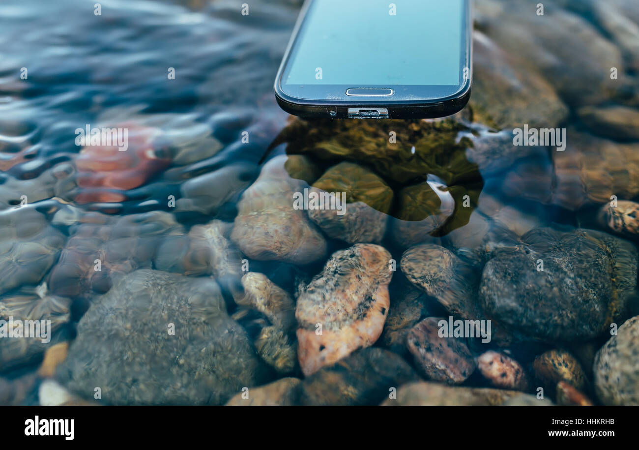 Lost man modern smartphone supported floating on the water Stock Photo ...
