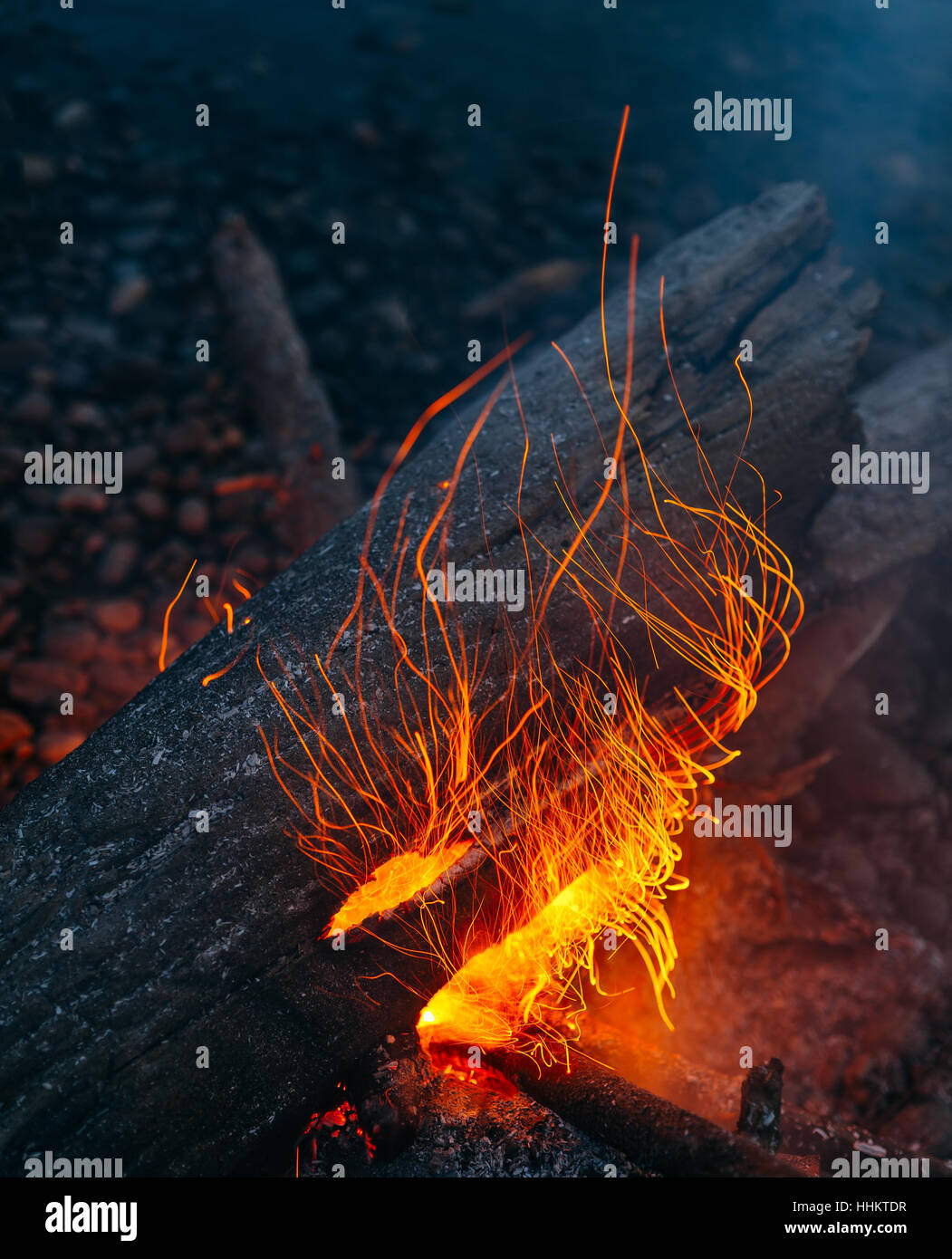 Magic fire on the river bank . Sparks, flames and other wonderful ...