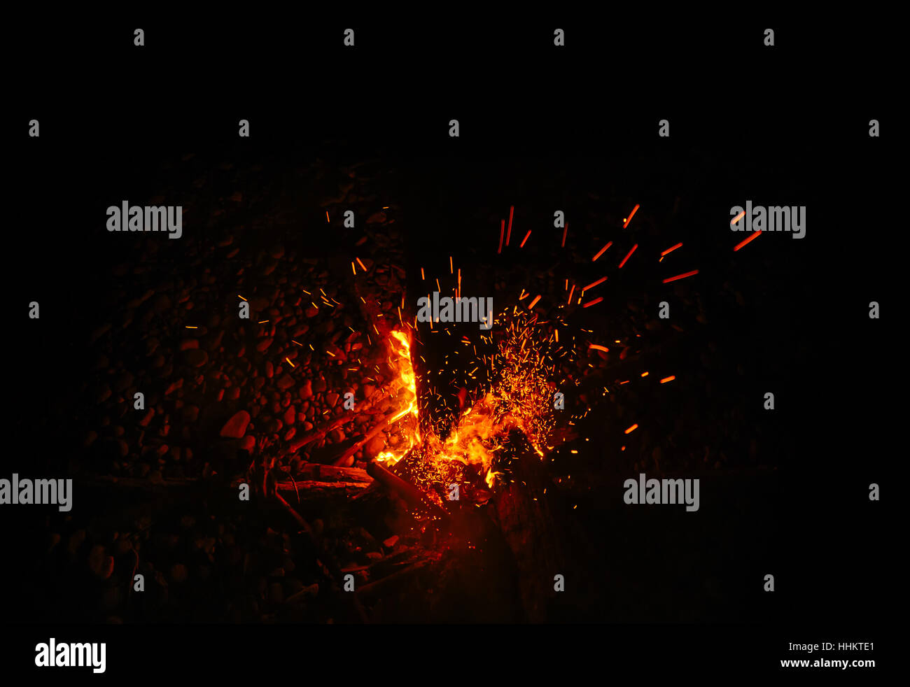 Magic fire on the river bank . Sparks, flames and other wonderful ...