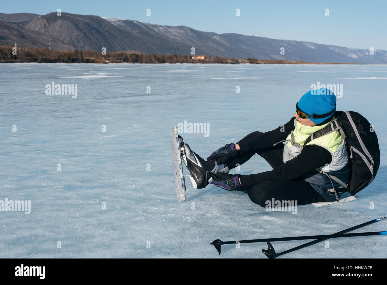 Tourists travel to Norway hiking ice skating on the frozen lake ...