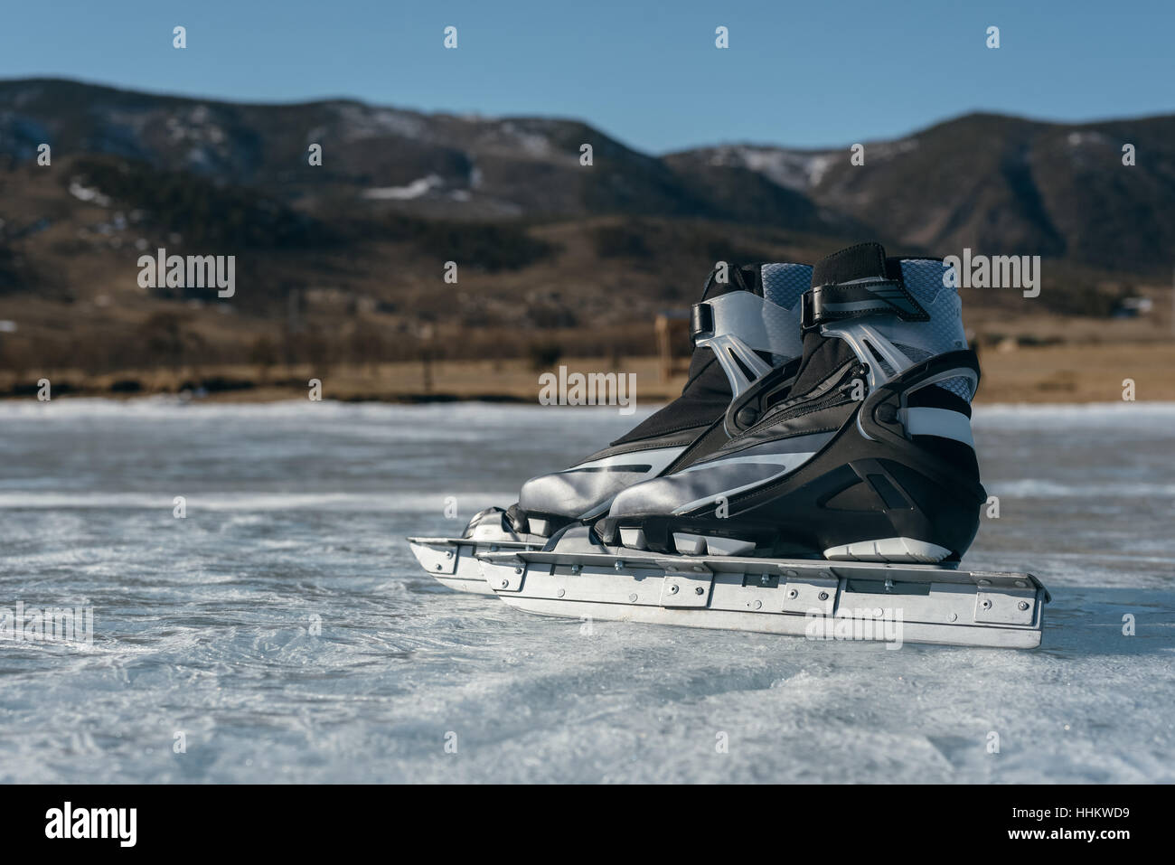 Tourists travel to Norway hiking ice skating on the frozen lake ...