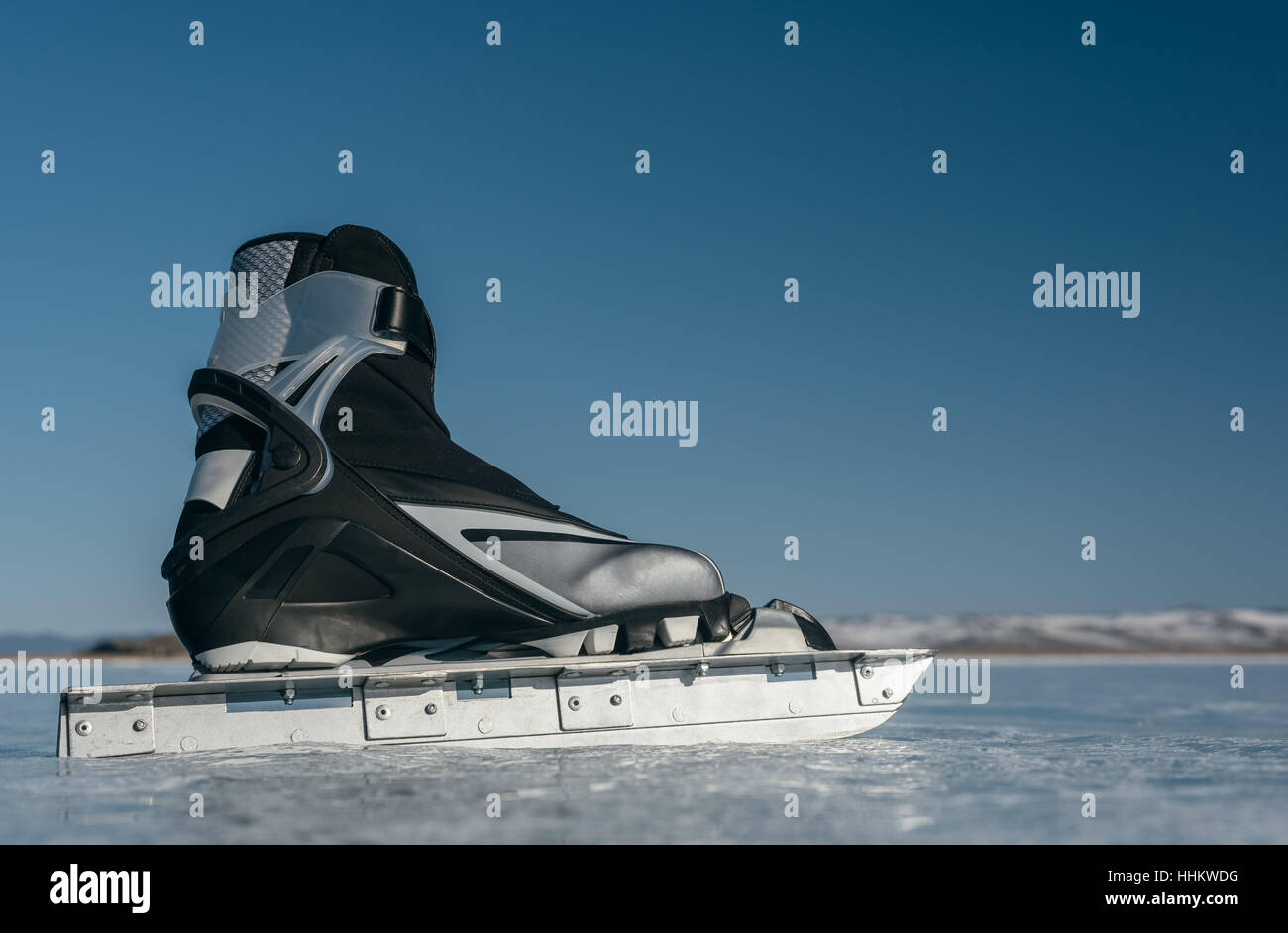 Tourists travel to Norway hiking ice skating on the frozen lake ...