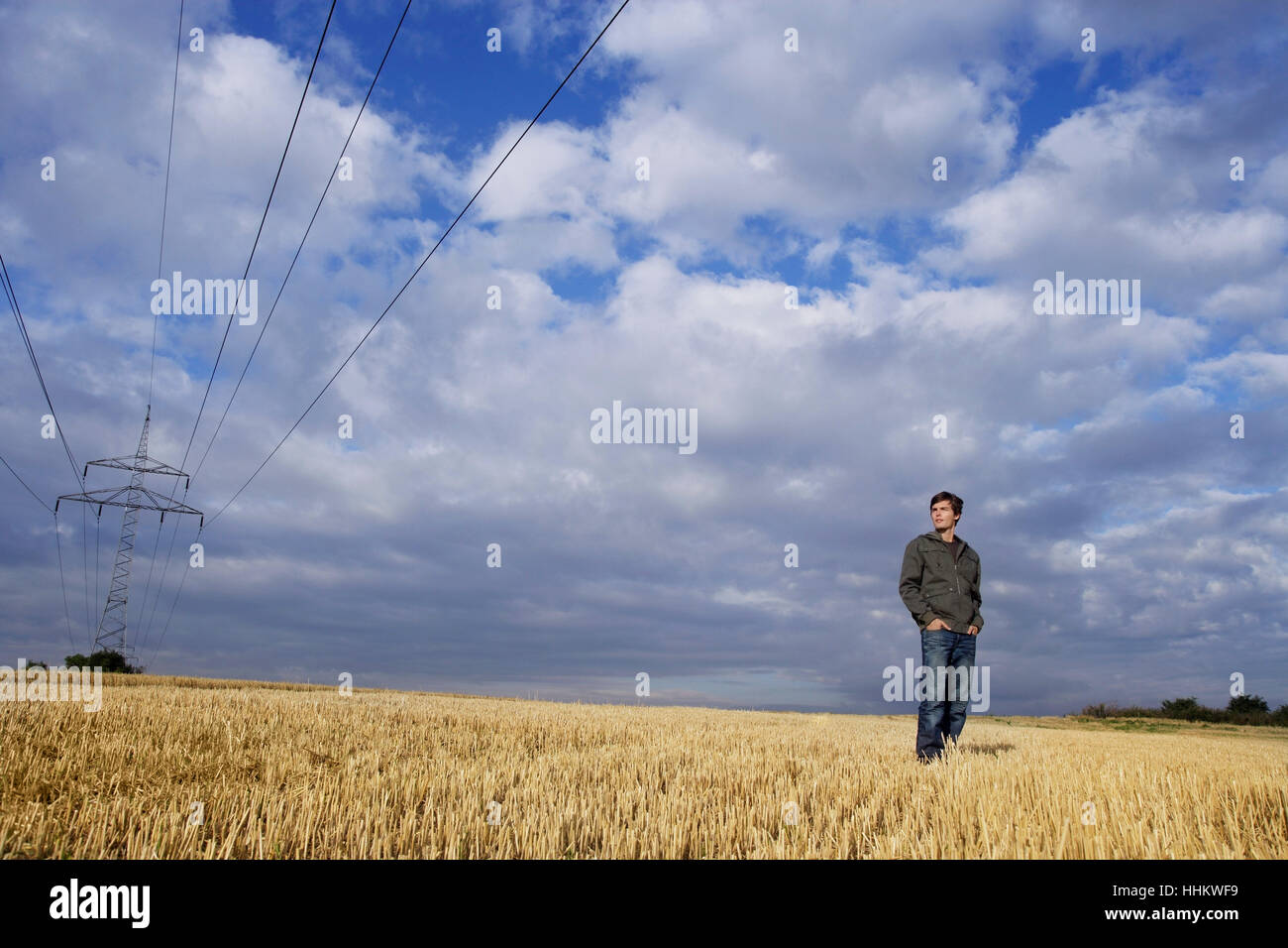 Young man in field Stock Photo - Alamy