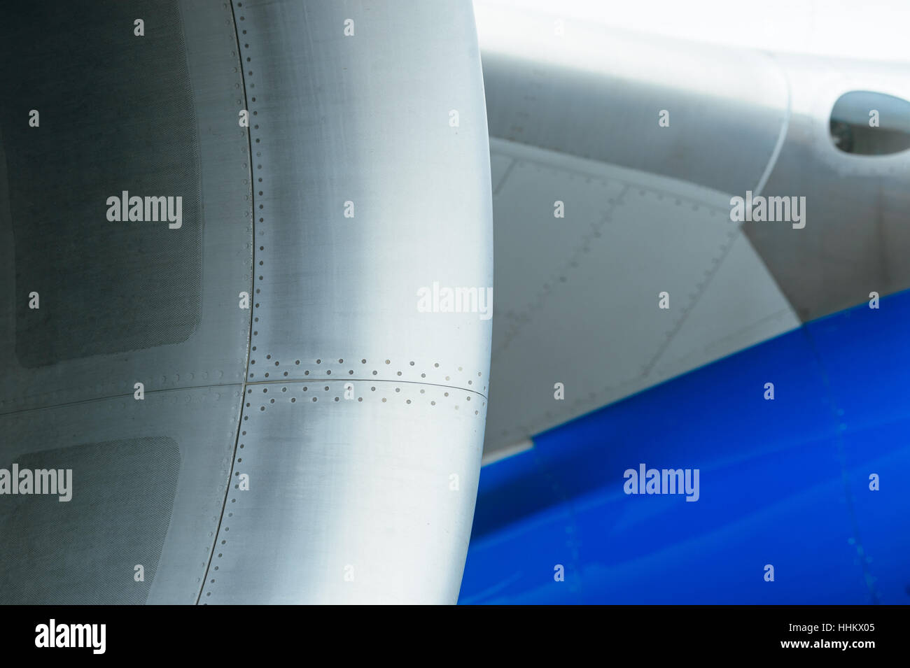 Airplane on the airfield. The fuselage of the aircraft. Screw close-up ...