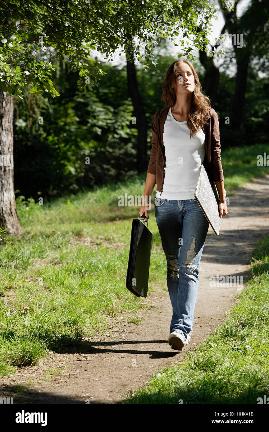 Art student walking on path Stock Photo - Alamy