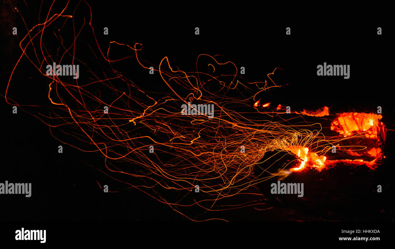 sparkling fire-breathing jaws of burning wood in the wildfire Stock ...