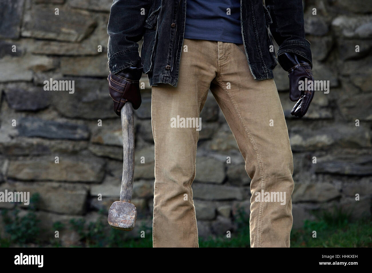 Man holding axe Stock Photo - Alamy