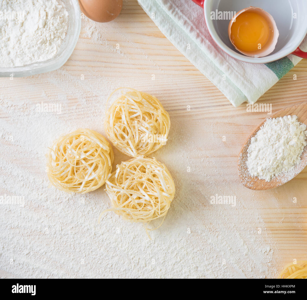 preparation of traditional italian homemade tagliatelle pasta with ...