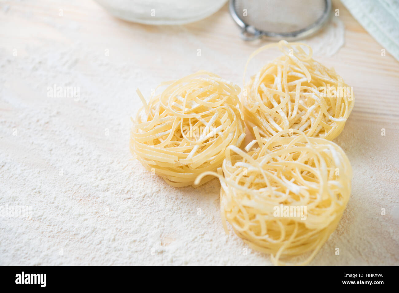 preparation of traditional italian homemade tagliatelle pasta with ...