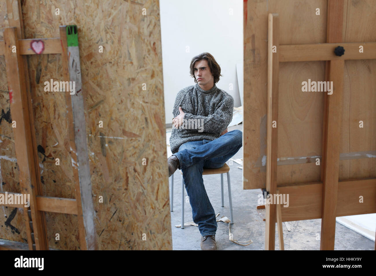 artist sitting in studio Stock Photo - Alamy
