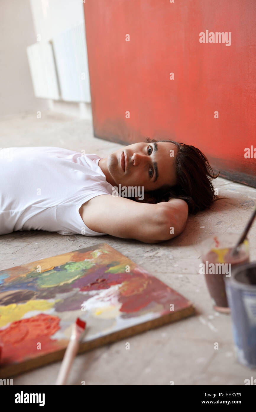 artist on ground with paints Stock Photo - Alamy