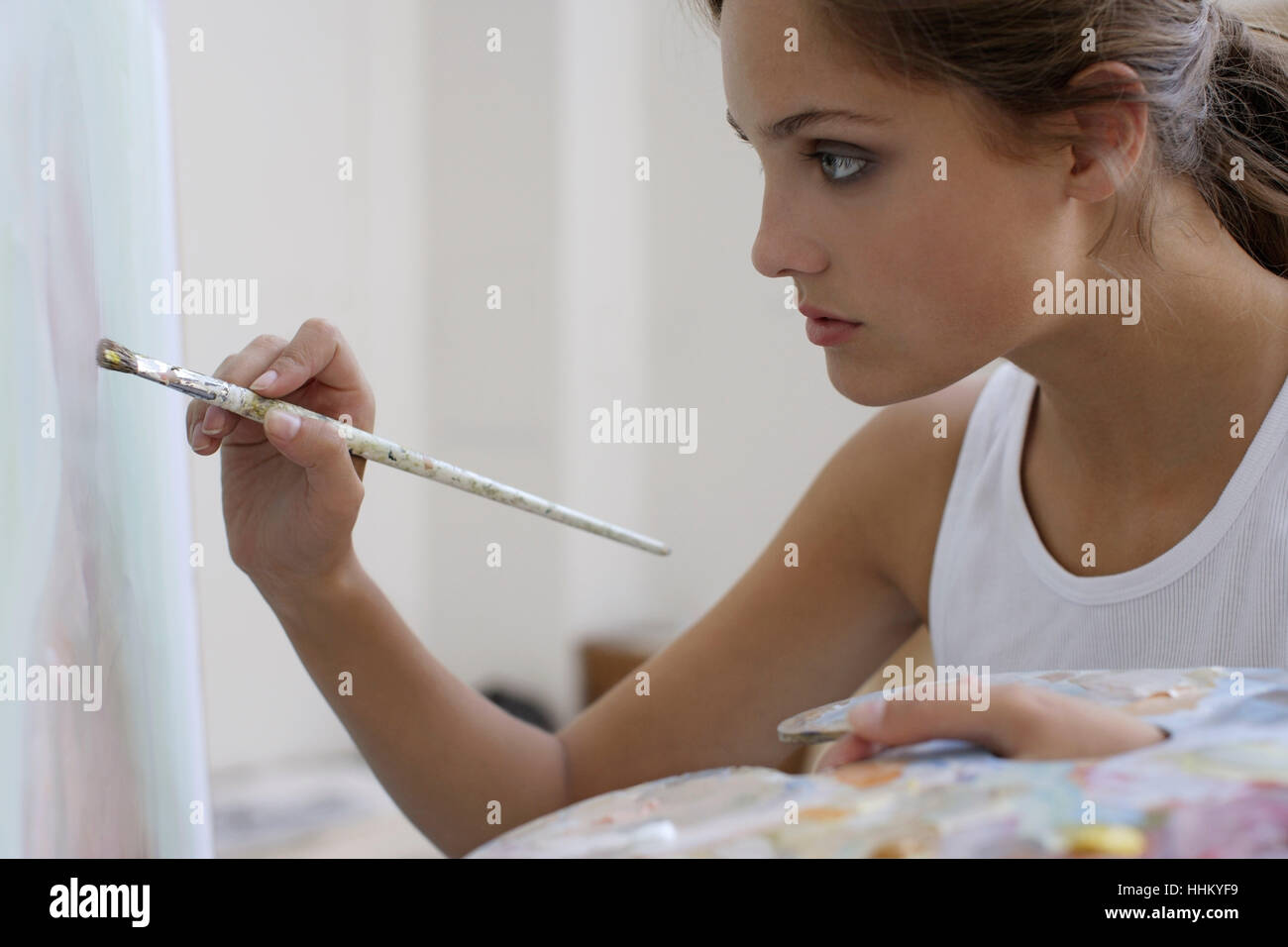 artist working on painting Stock Photo - Alamy