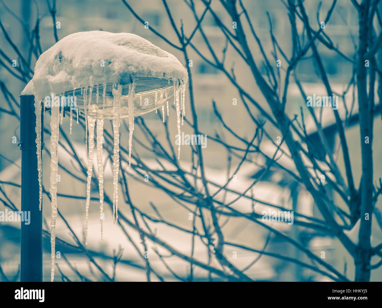 frozen streetlight with icicles on a cold winter day Stock Photo - Alamy