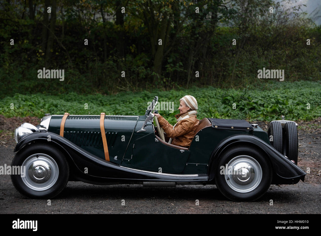 Profile of senior woman in antique car Stock Photo - Alamy