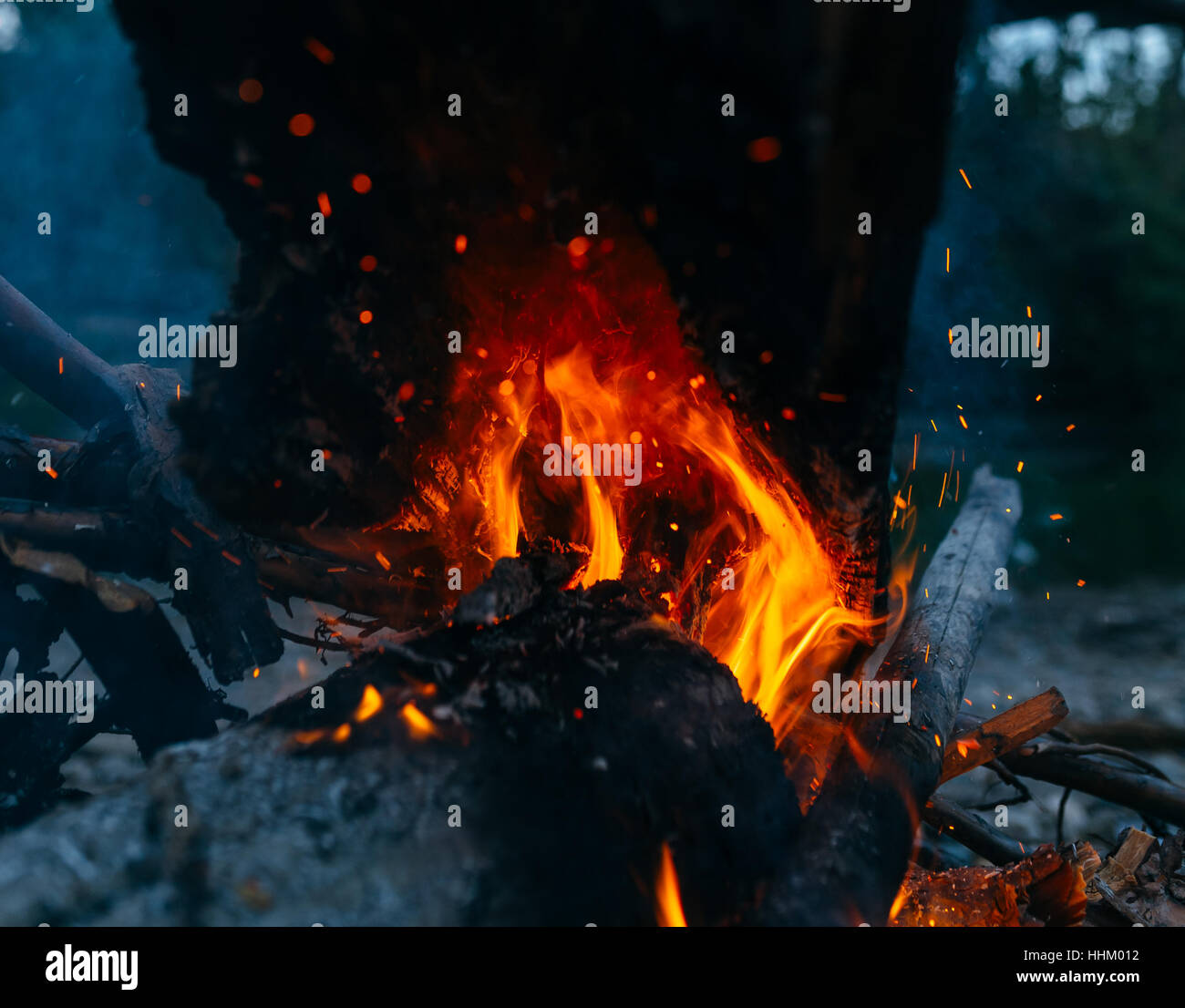 Magic fire on the river bank . Sparks, flames and other wonderful ...