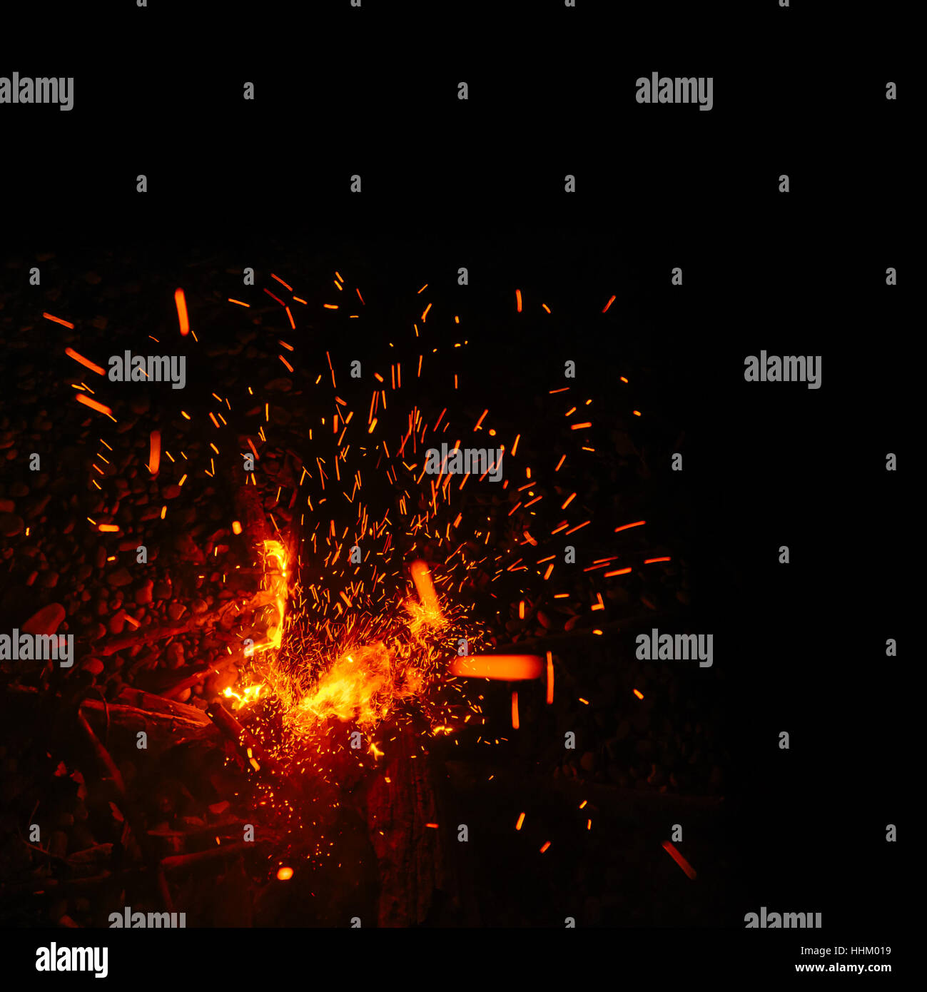 Magic fire on the river bank . Sparks, flames and other wonderful ...