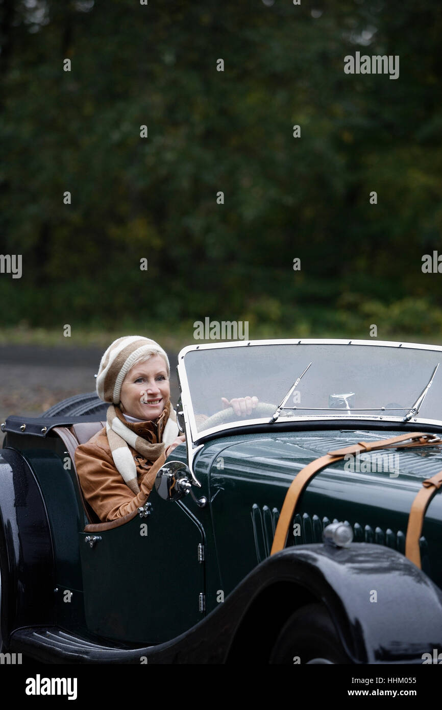 senior woman driving antique car Stock Photo - Alamy
