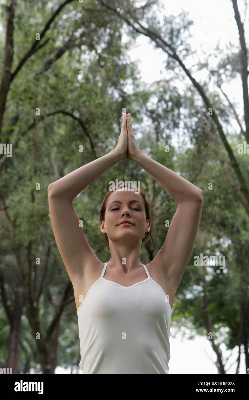 Woman pose in trees hi-res stock photography and images - Alamy