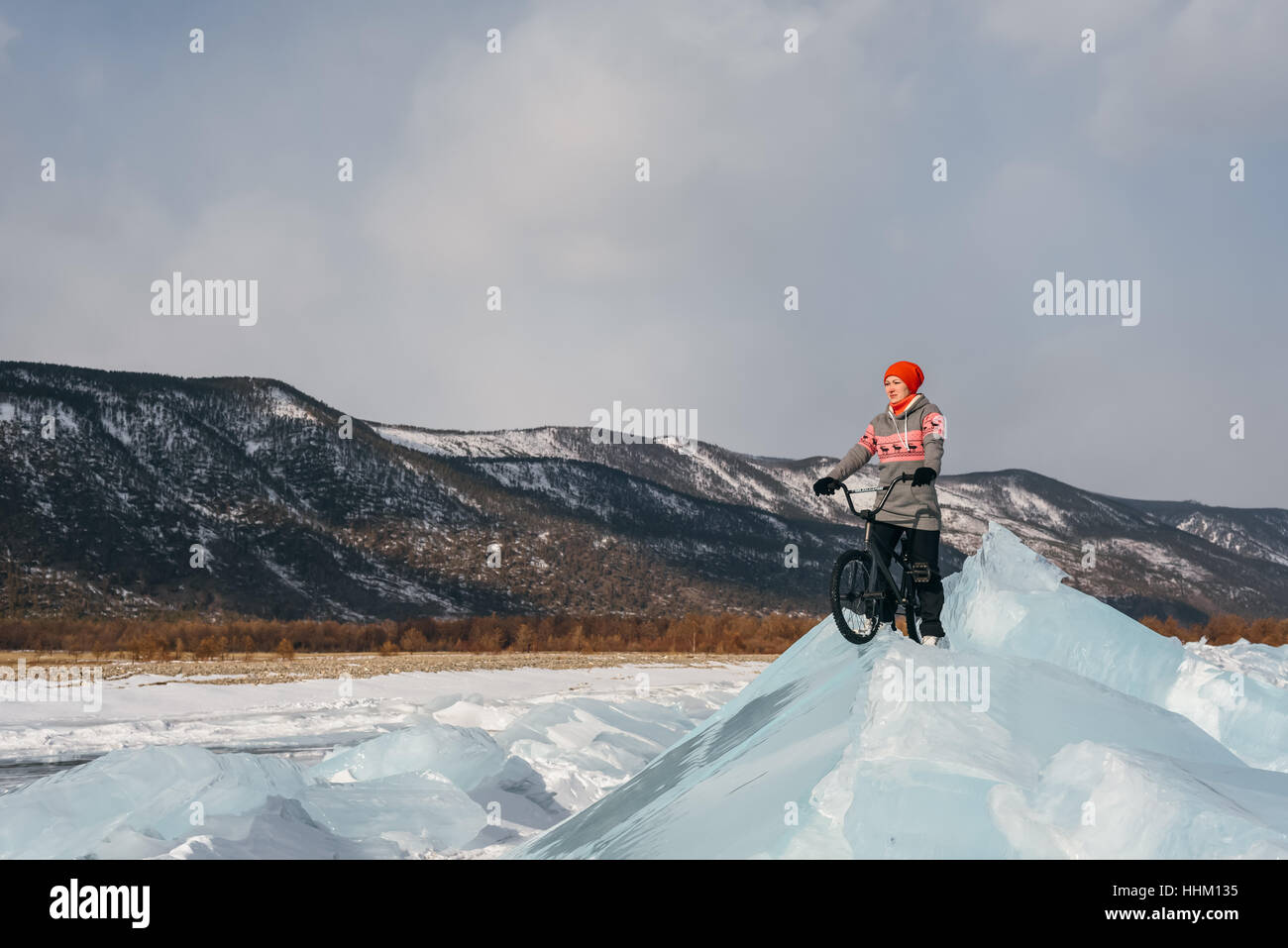 Girl on a bmx on ice Stock Photo - Alamy
