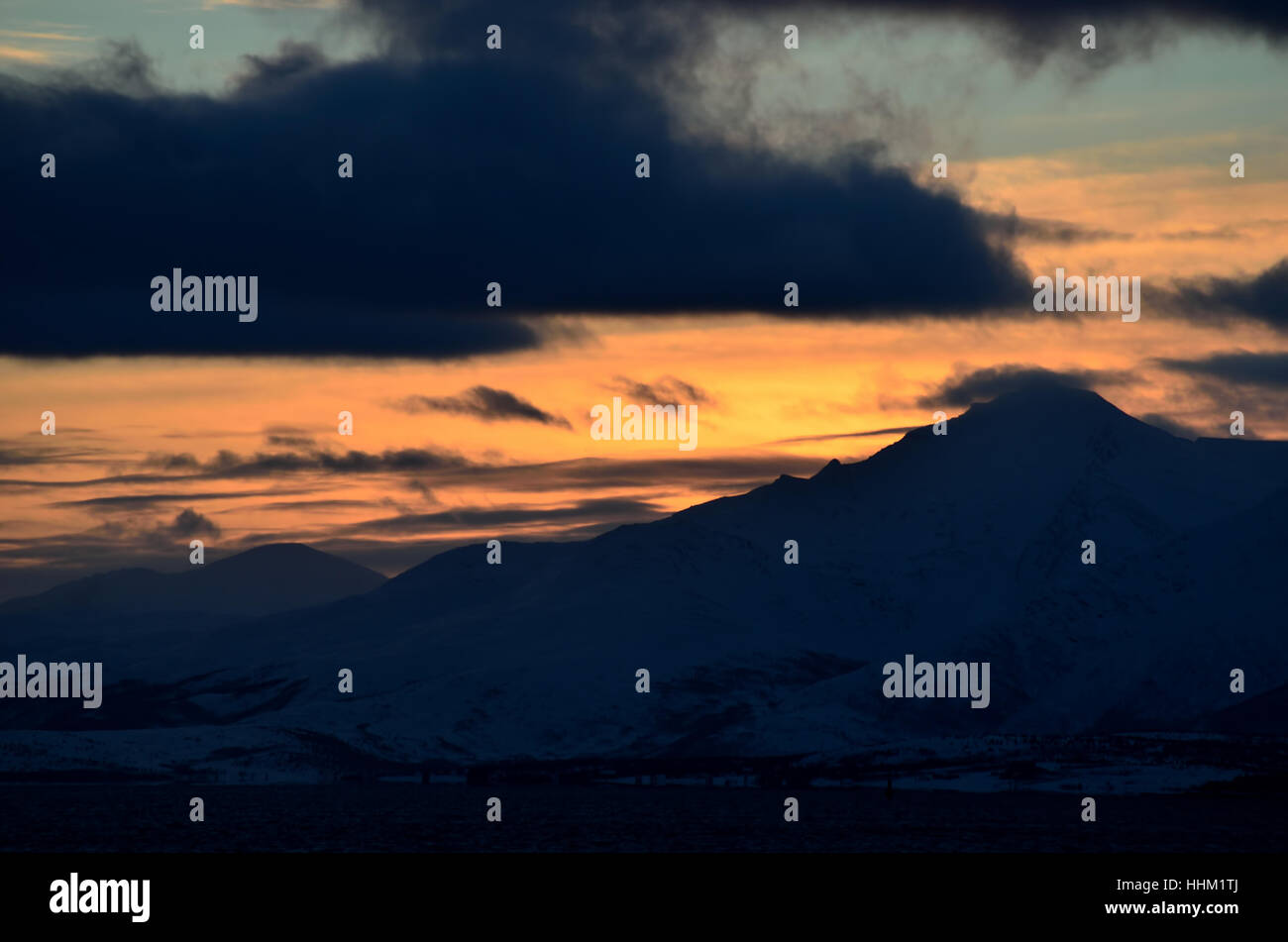colorful dawn sky over snowy mountain and sea Stock Photo - Alamy