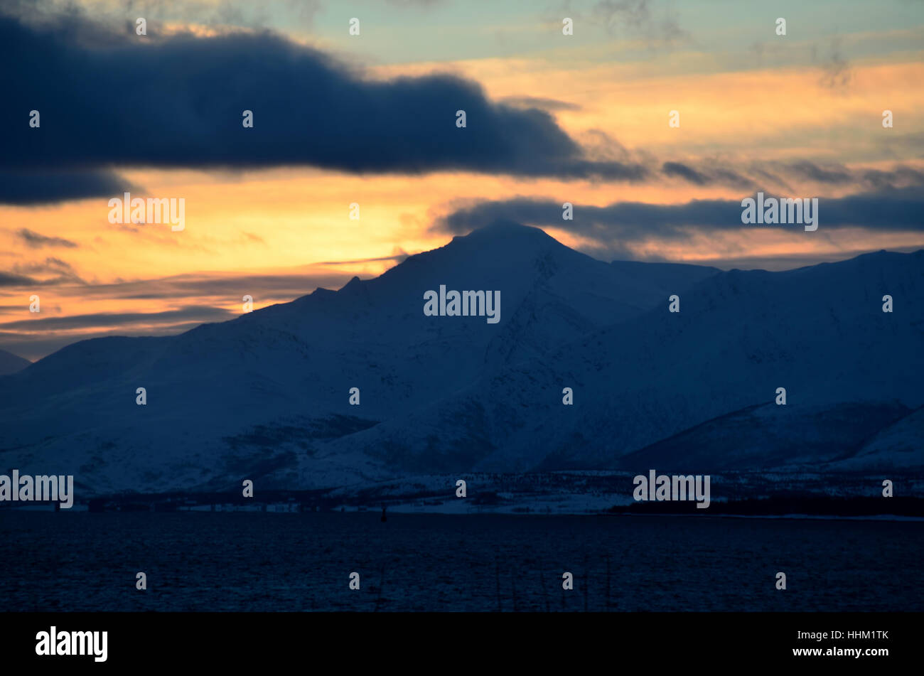 colorful dawn sky over snowy mountain and sea Stock Photo - Alamy