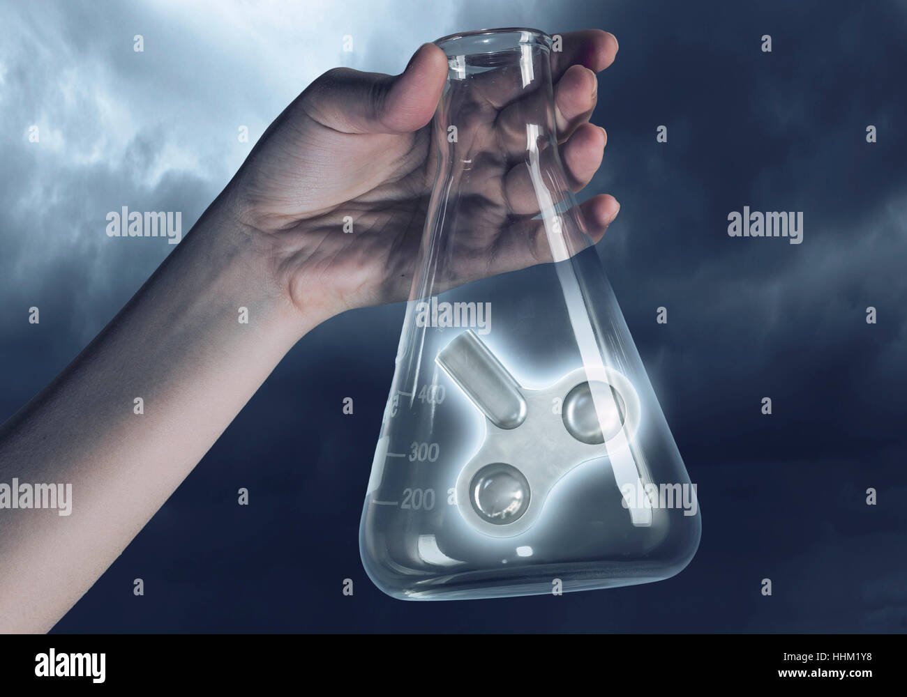 Close up of human hand holding test tube with key Stock Photo - Alamy