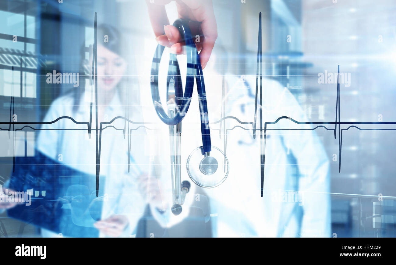 Exposure image of doctor hand with stethoscope and media concept. Mixed ...
