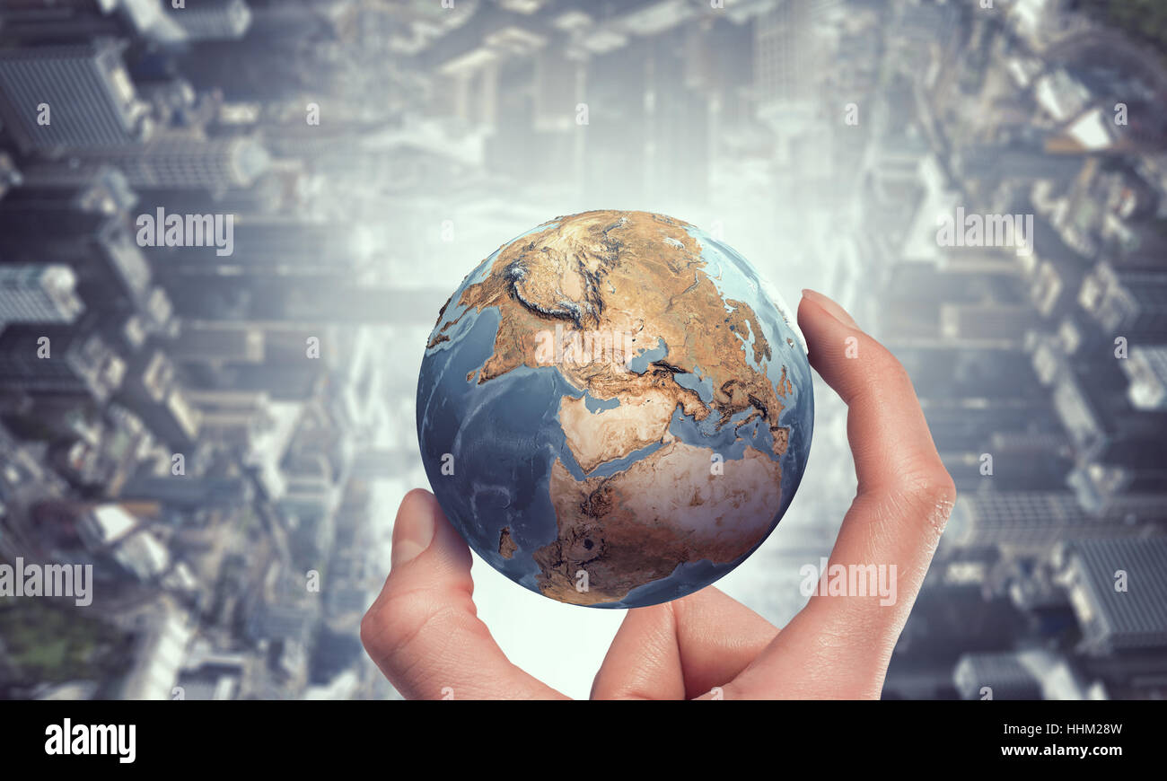 Small Earth planet ball between female fingers. Elements of this image ...