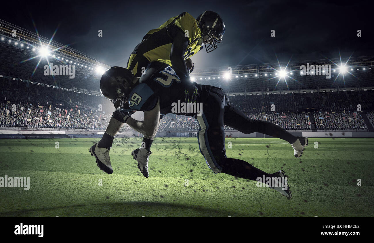 Two american football players fighting for ball. Mixed media Stock ...