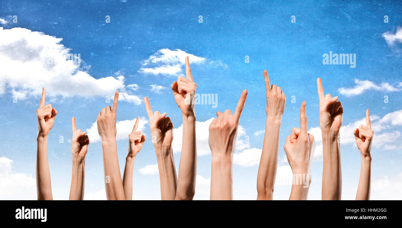 Row of raised hands showing different gestures Stock Photo - Alamy