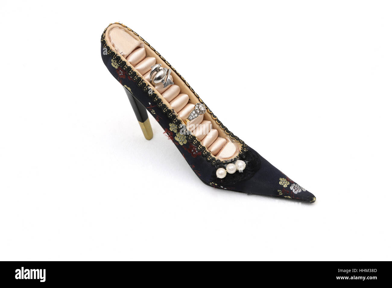 Stiletto Heel Shoe Ring Holder And Rings Stock Photo - Alamy