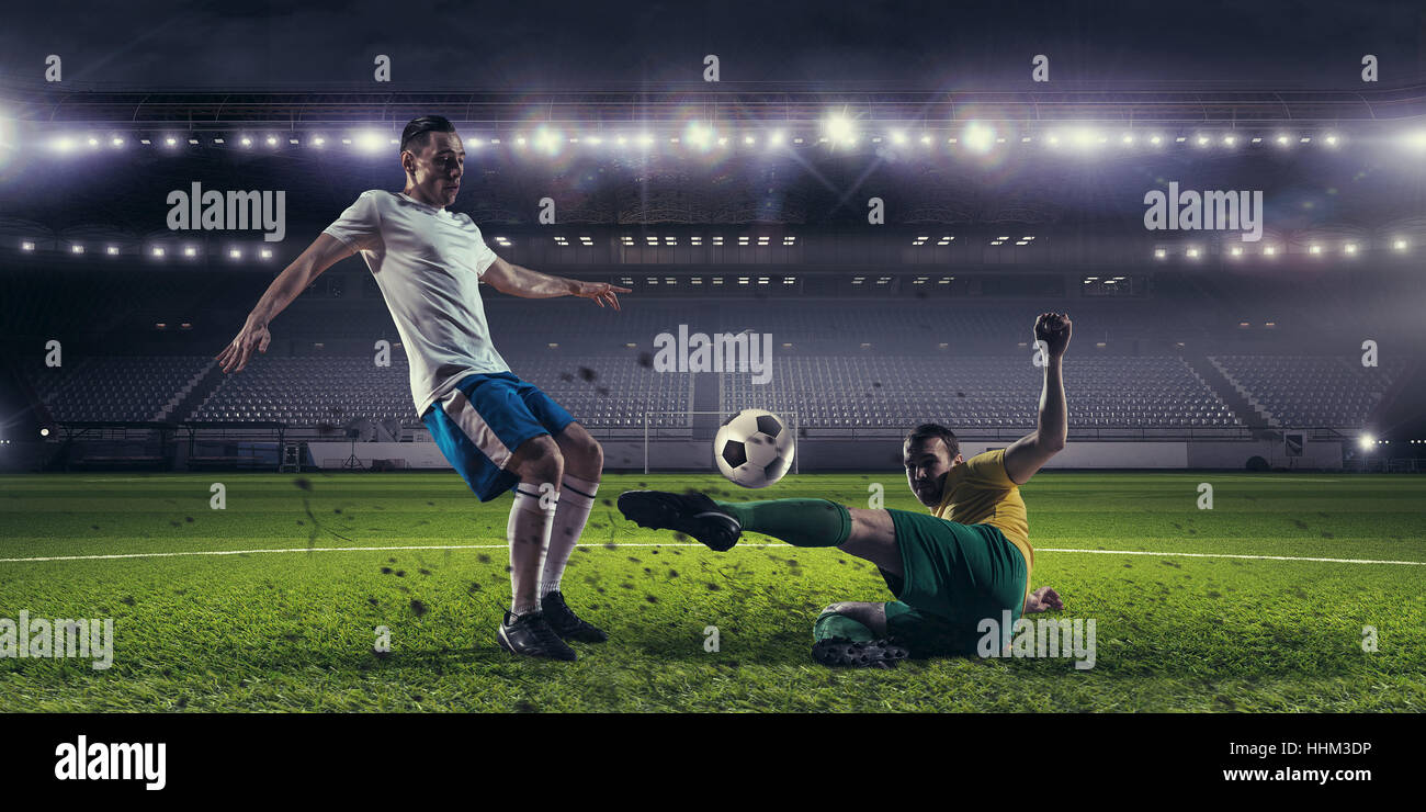 Soccer players in action on stadium fighting for ball. Mixed media ...