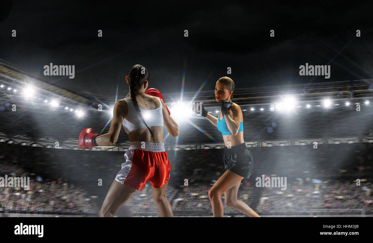 Two young pretty women boxing in ring. Mixed media Stock Photo - Alamy