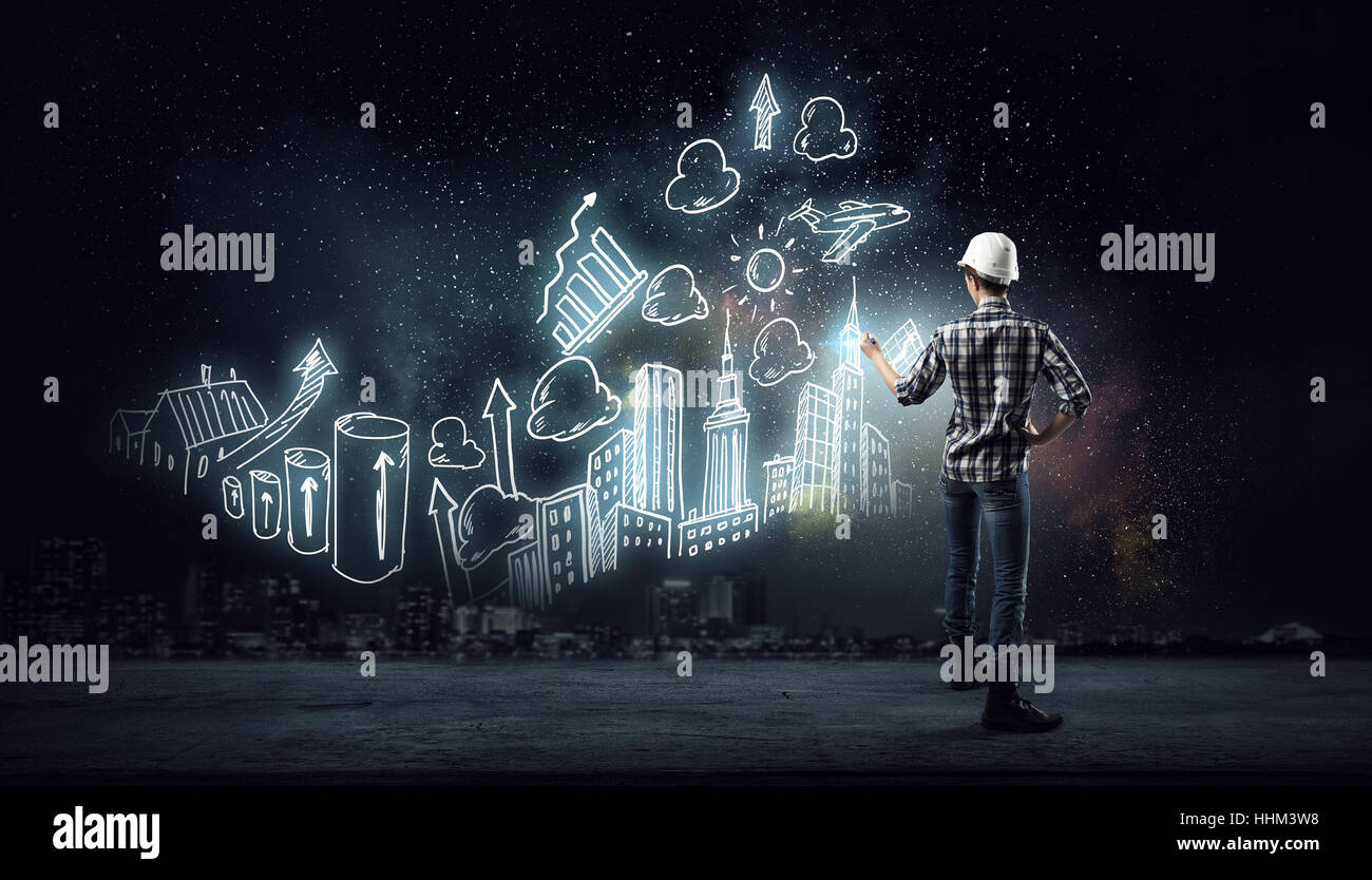 Rear view of engineer woman drawing construction plan Stock Photo - Alamy