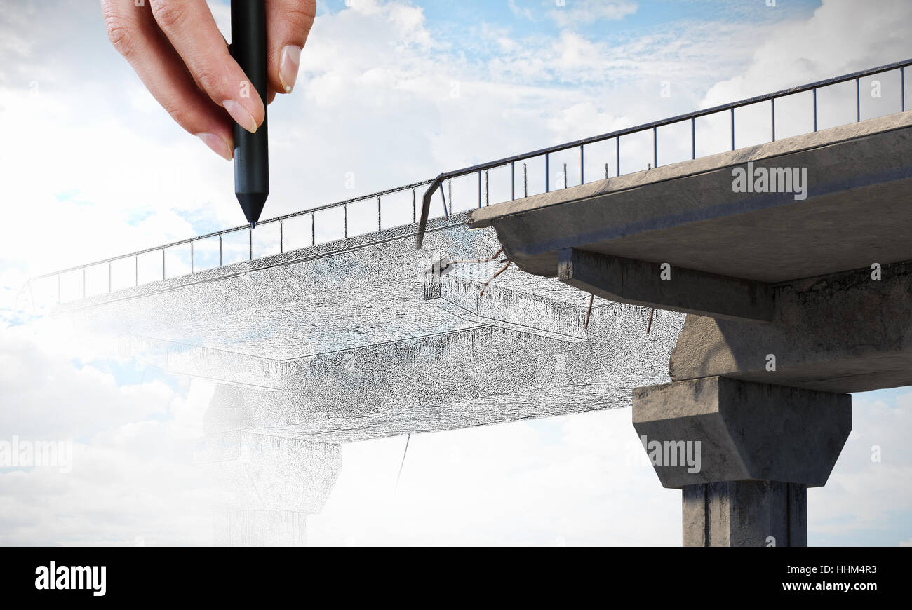 Hand of female drawing elements of crashed bridge Stock Photo - Alamy