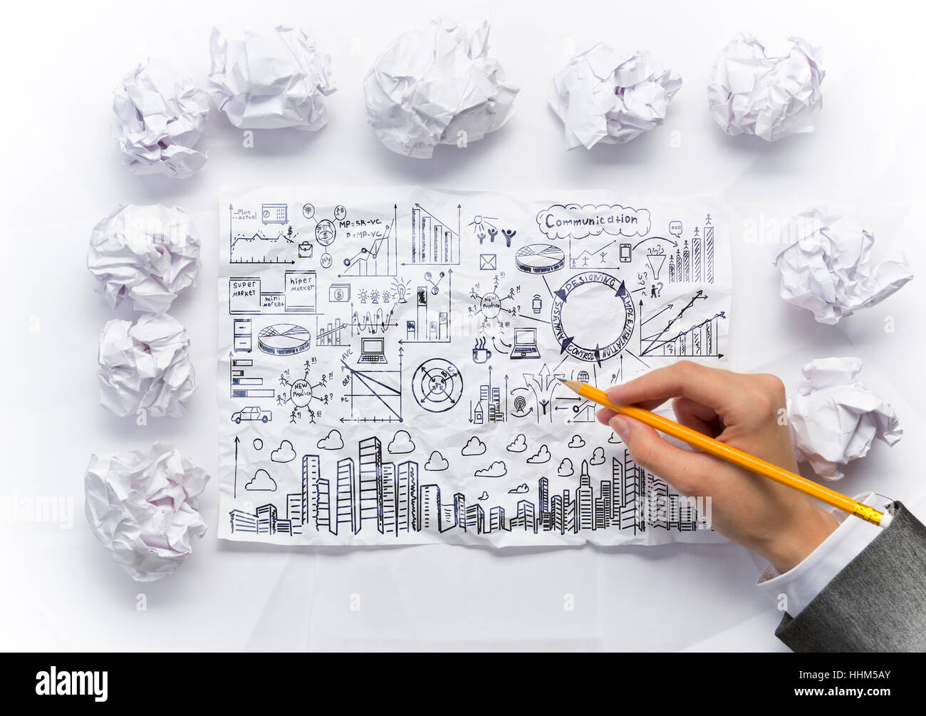 Hand of businesswoman drawing her success plan on crumpled paper Stock ...