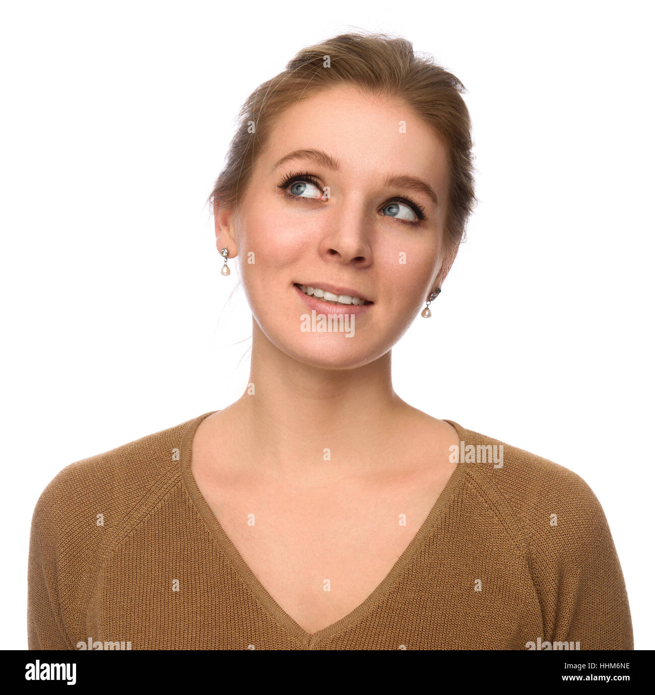 Portrait of a young thinking woman looking up. Isolated on white ...