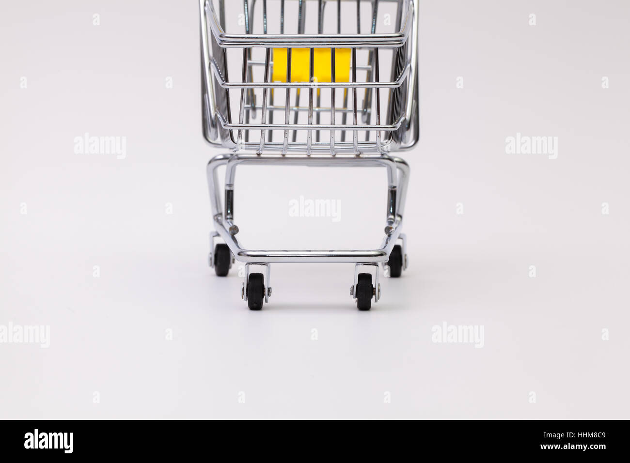 Shopping trolley on the white background Stock Photo - Alamy