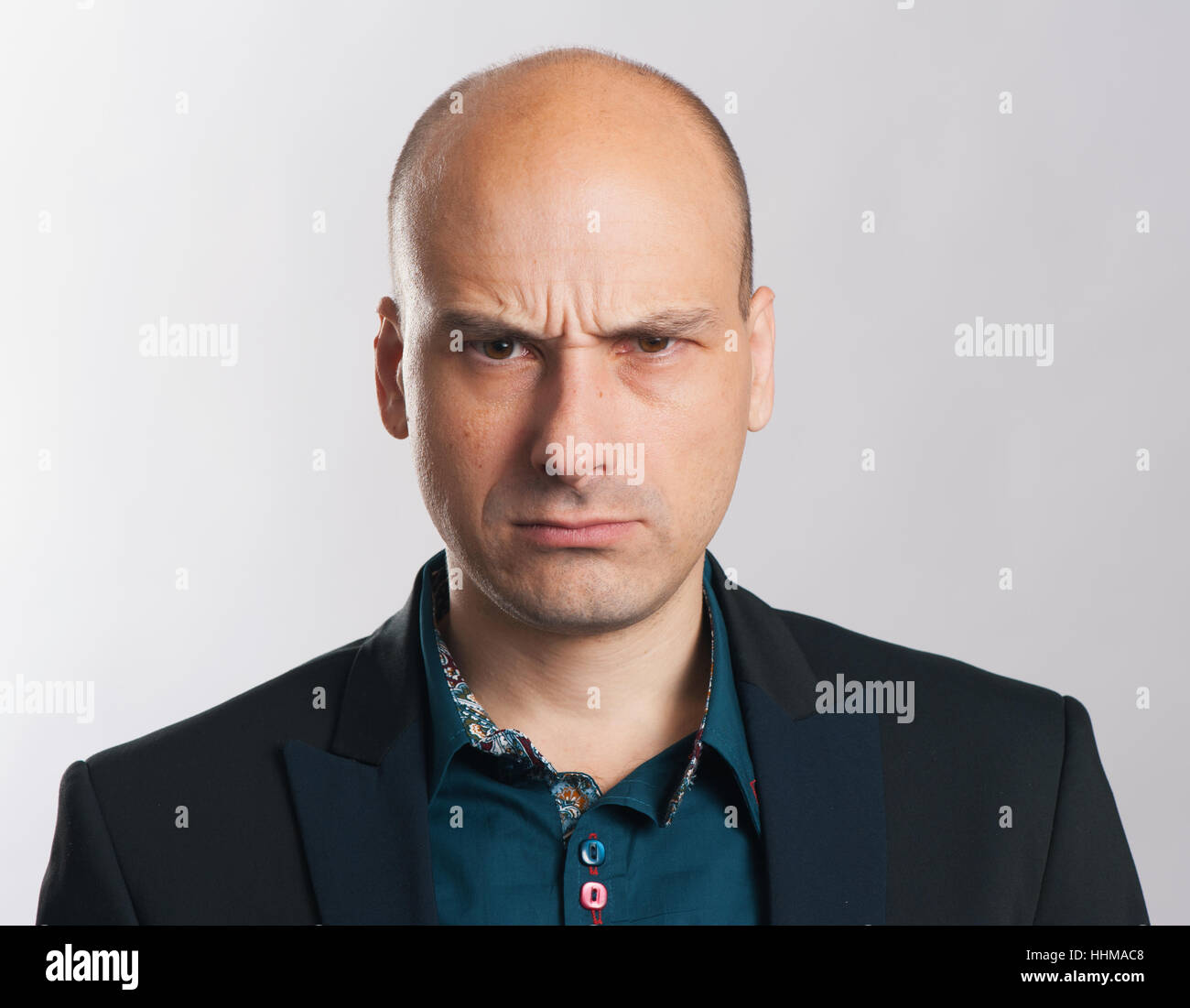 Angry bald dude expressive portrait. Studio shot Stock Photo - Alamy