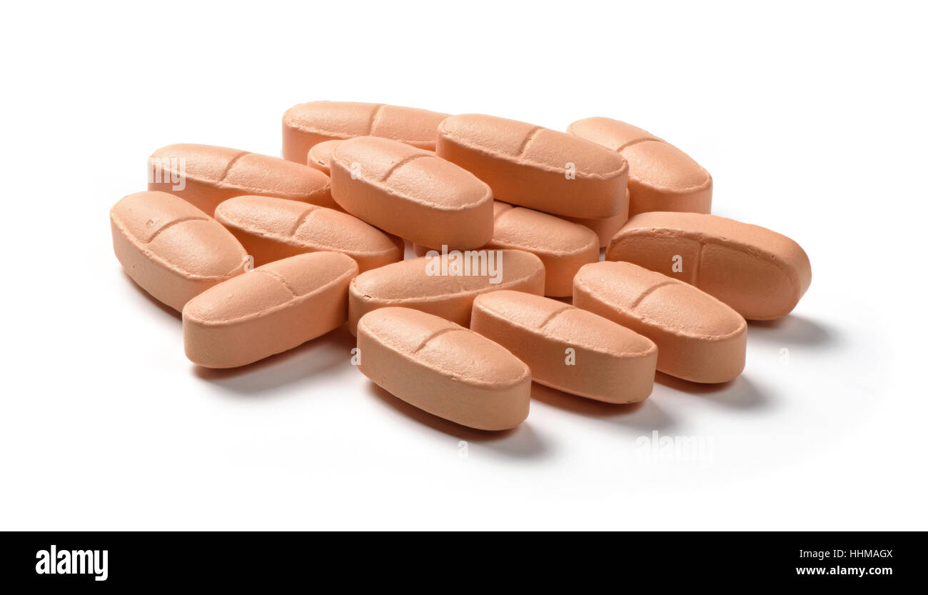 orange tablet pills, isolated on white background Stock Photo - Alamy