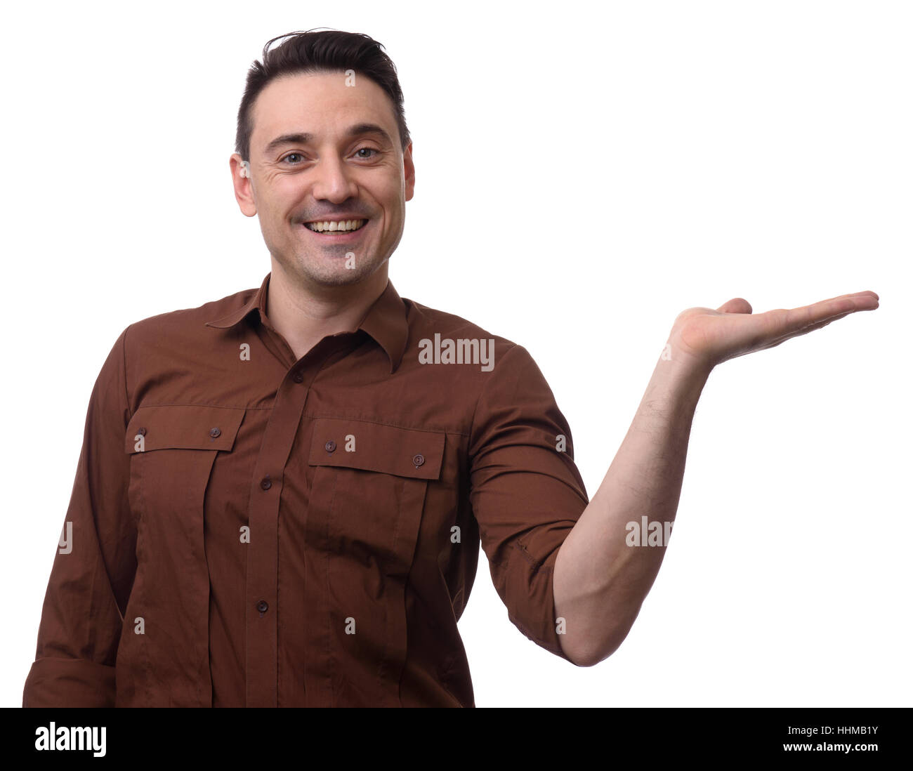 smiling man presenting something with palm up. Isolated on white Stock ...