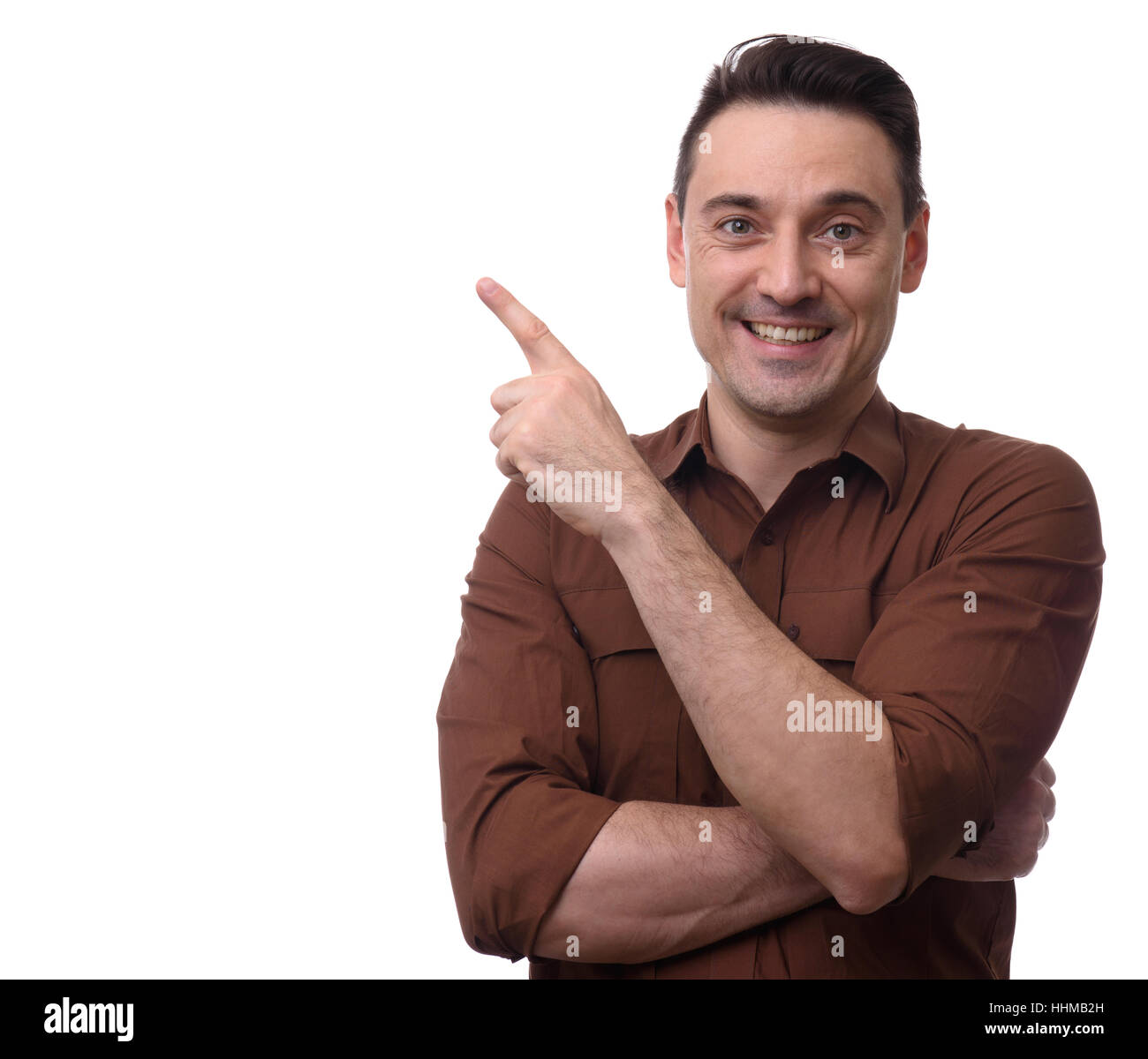 smiling man pointing finger to copy space. Isolated on white background ...