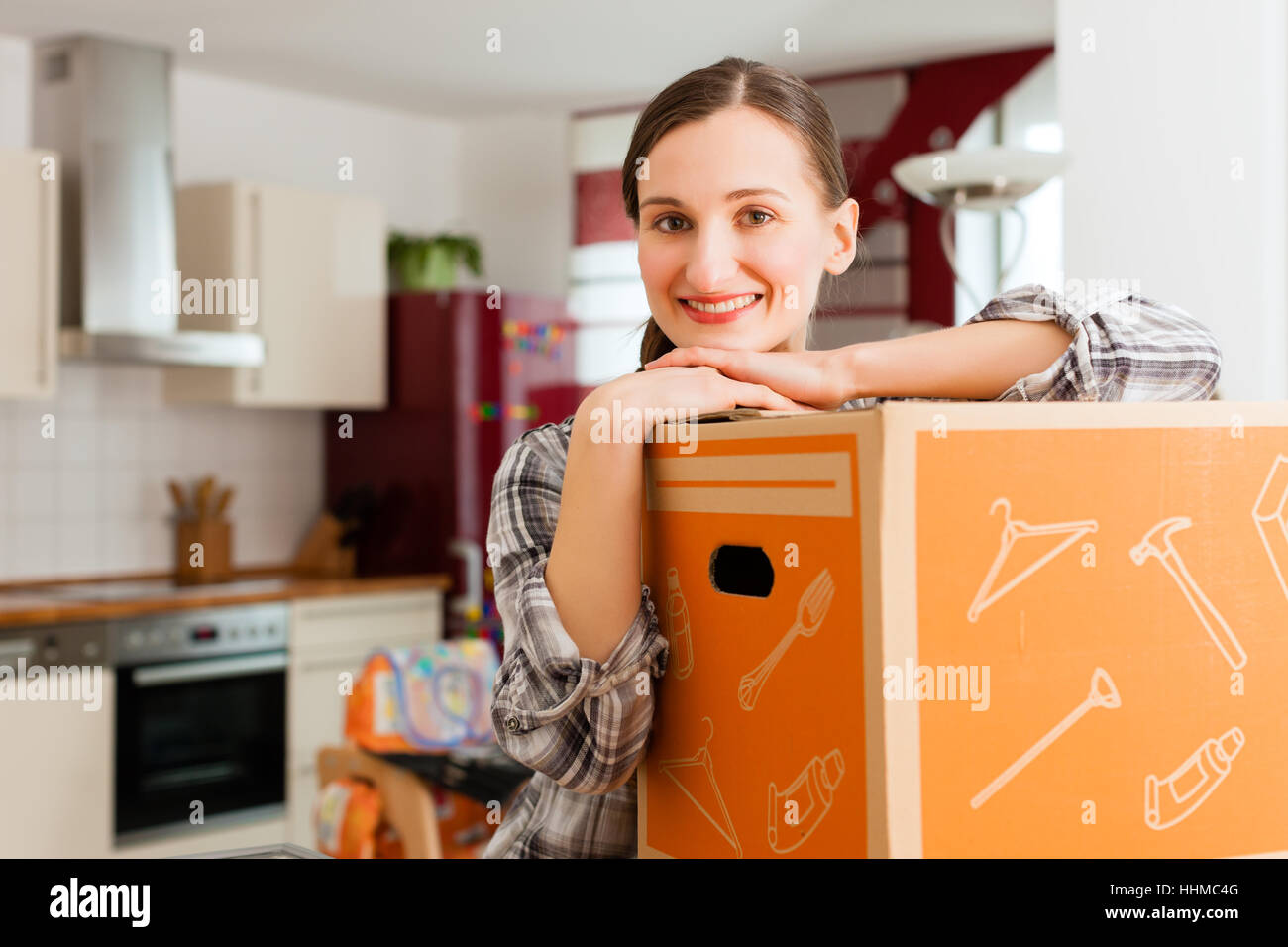 woman with moving box when moving or extract Stock Photo - Alamy