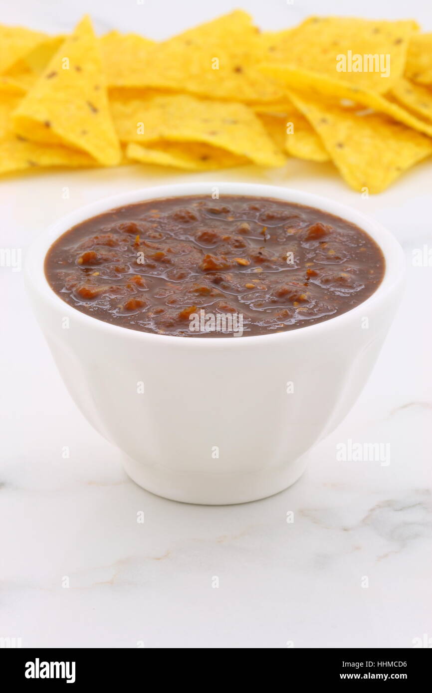 Artisan mexican chipotle sauce on vintage carrara marble table, with a ...