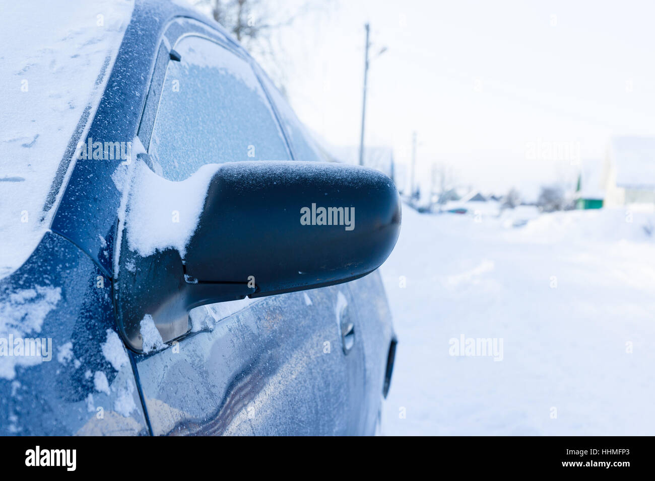 blue car covered with snow during a blizzard Stock Photo - Alamy